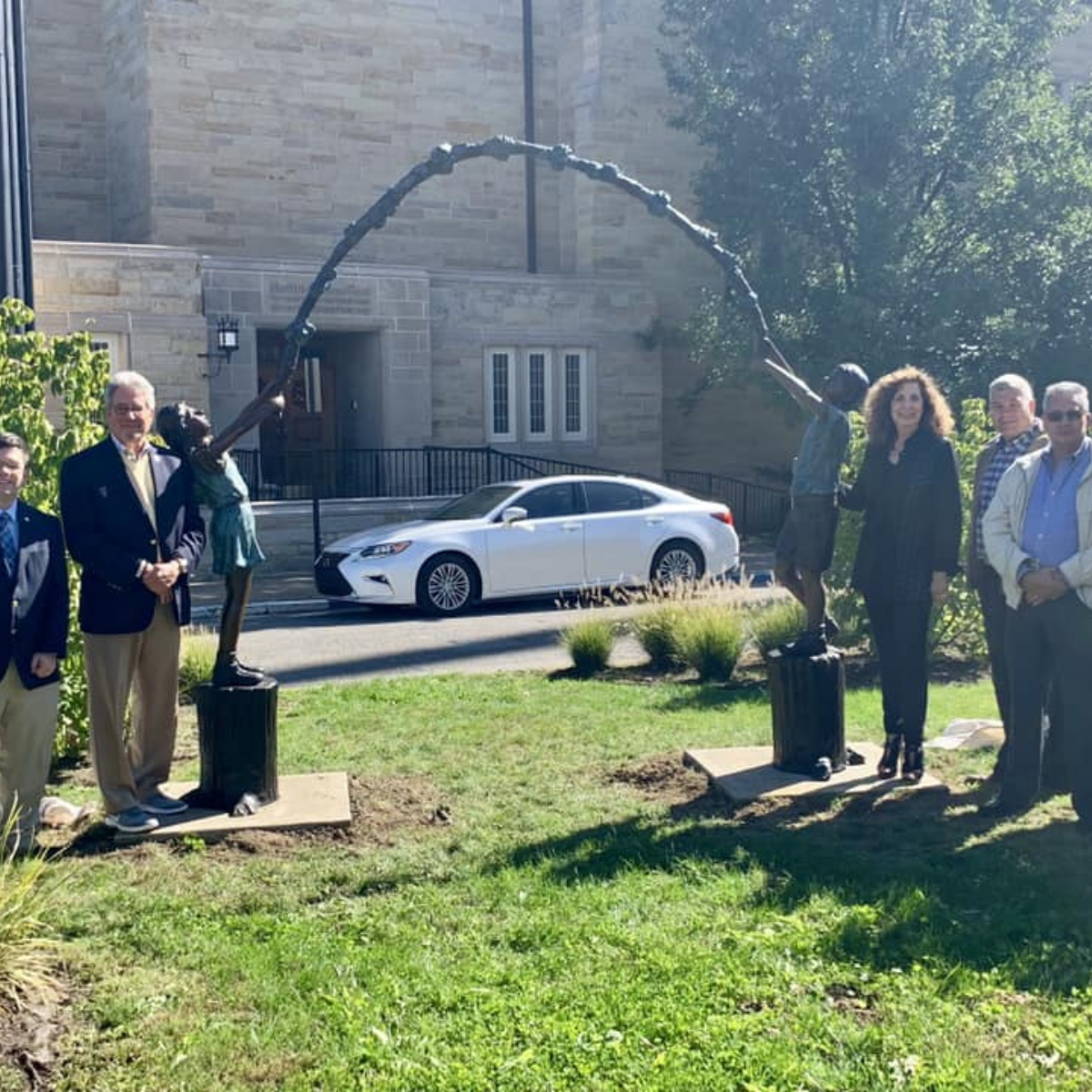 Bronze Garden Statue Of Kids Holding an Arbor | Randolph Rose Collection