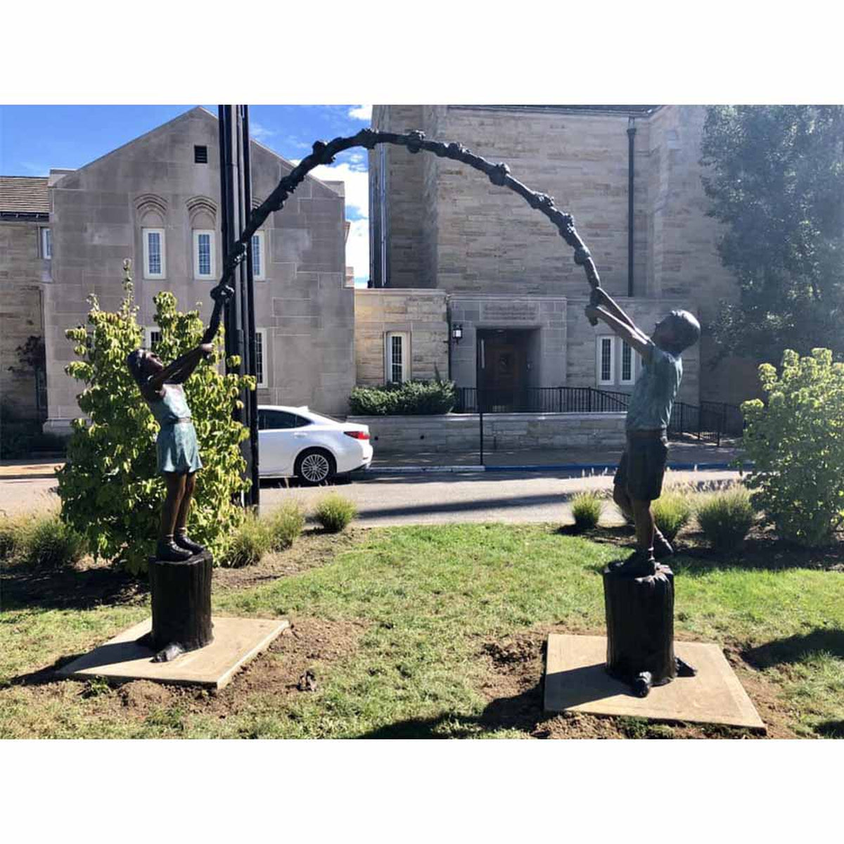 Bronze Garden Statue Of Kids Holding an Arbor | Randolph Rose Collection
