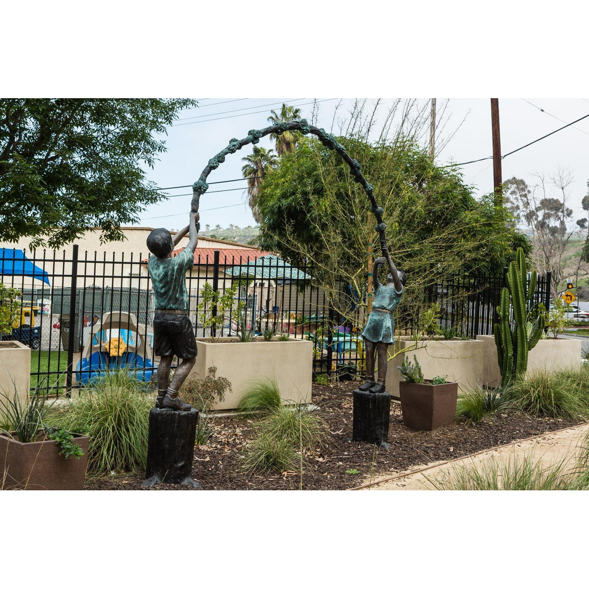 Bronze Garden Statue Of Kids Holding an Arbor | Randolph Rose Collection