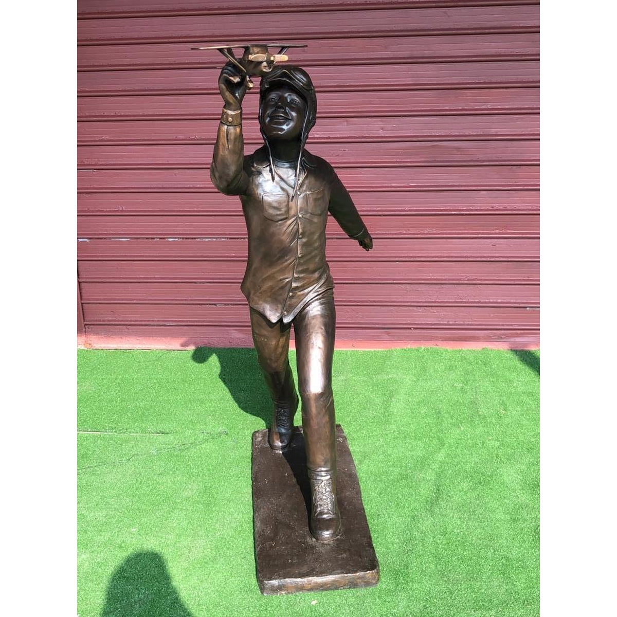 Bronze Statue of a Boy Flying a Plane | Randolph Rose Collection