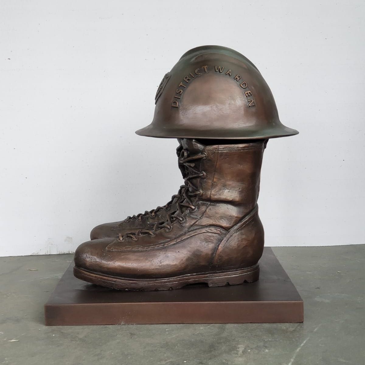 Custom Bronze Fireman Helmet & Boots Statue | Randolph Rose Collection